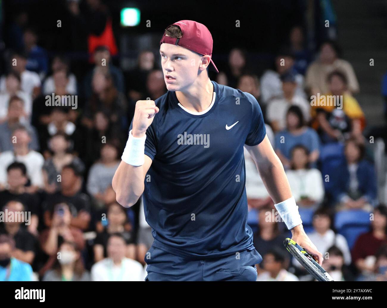 Tokyo, Japan. 29th Sep, 2024. Holger Rune of Denmark clinches his fist as he won a key point ...