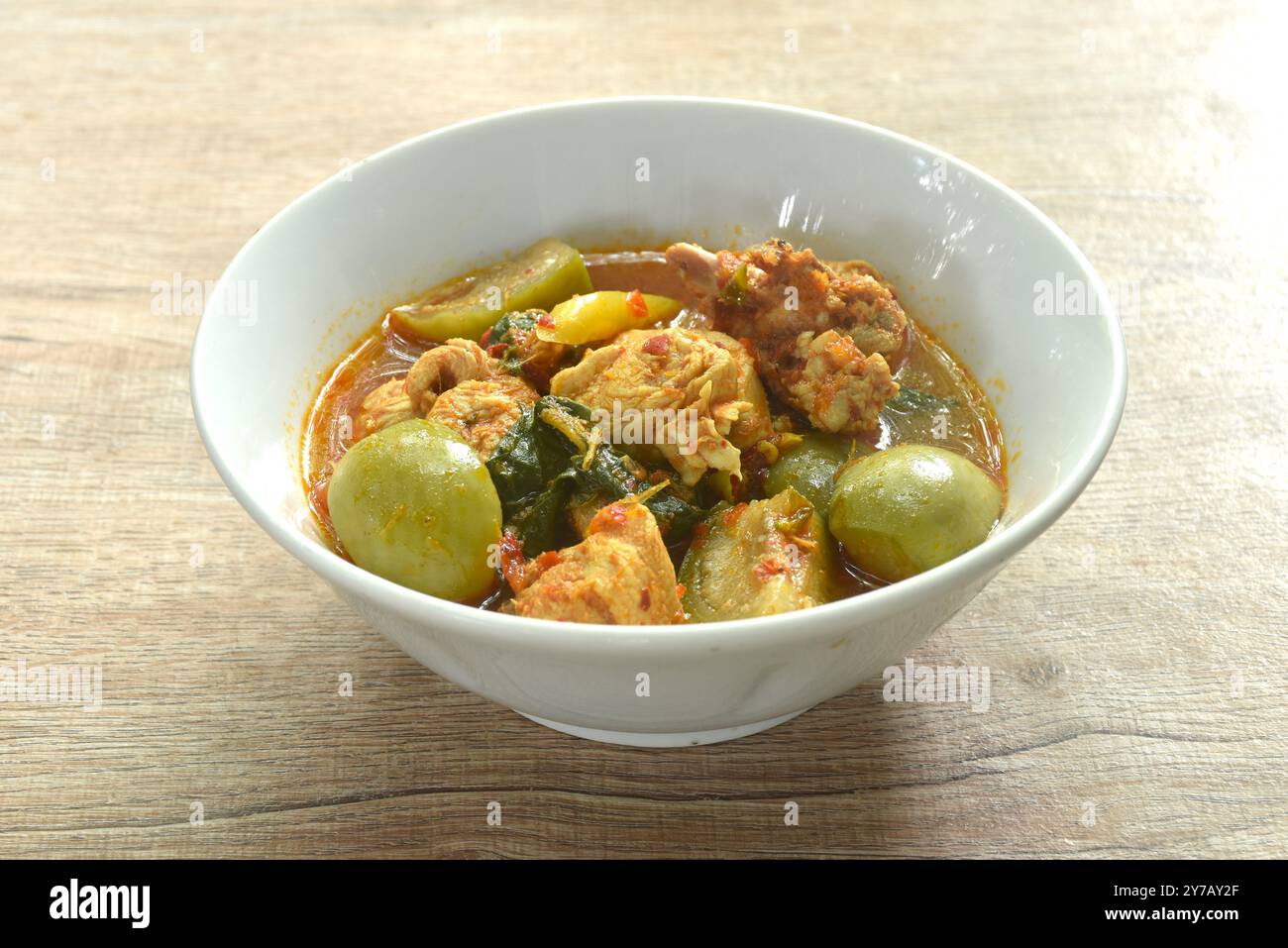 spicy boiled chicken with mixed vegetable in jungle curry soup Thai ...