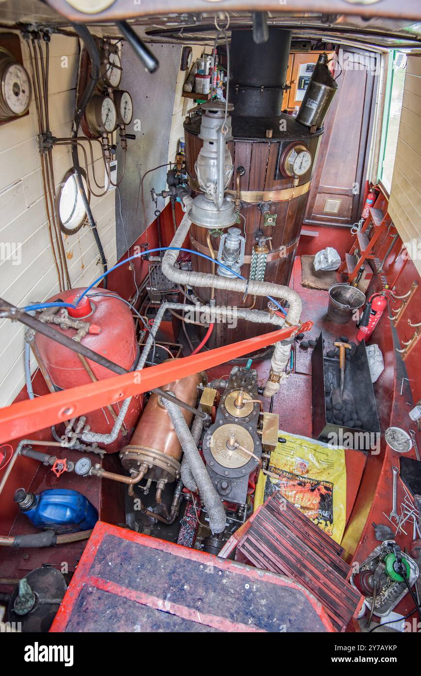 'Tixall', a steam driven narrowboat parked up near the low road bridge ...
