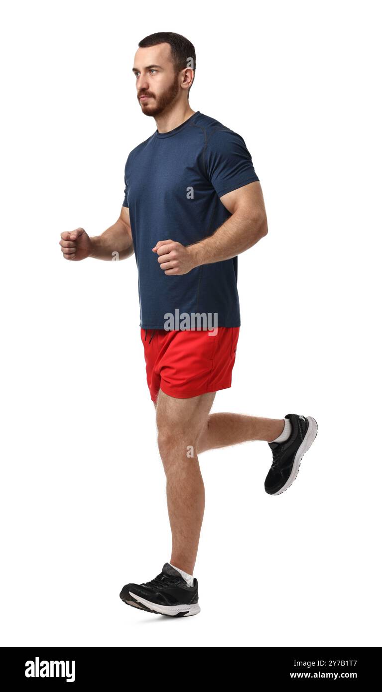 Handsome young man running on white background Stock Photo - Alamy