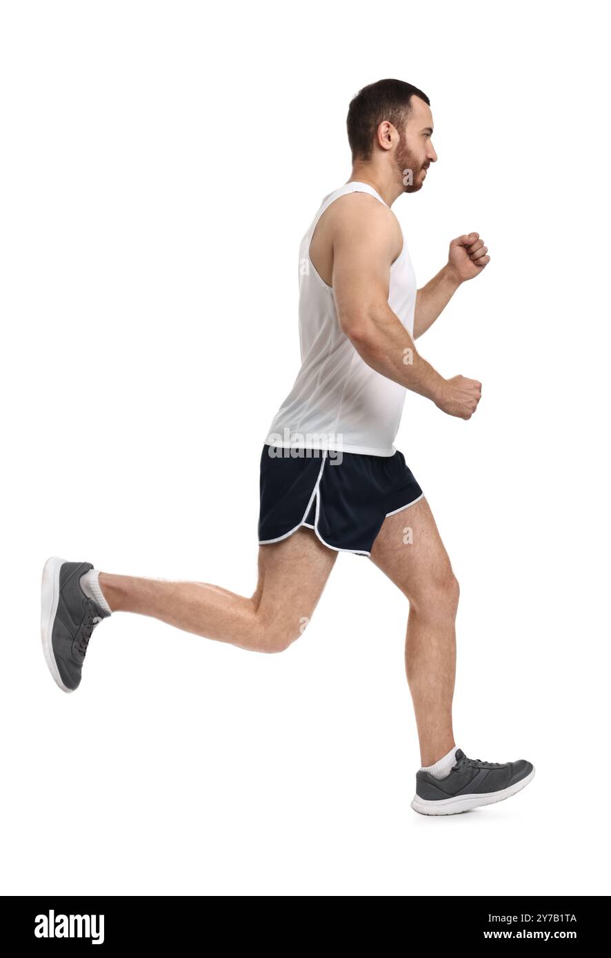 Handsome young man running on white background Stock Photo - Alamy