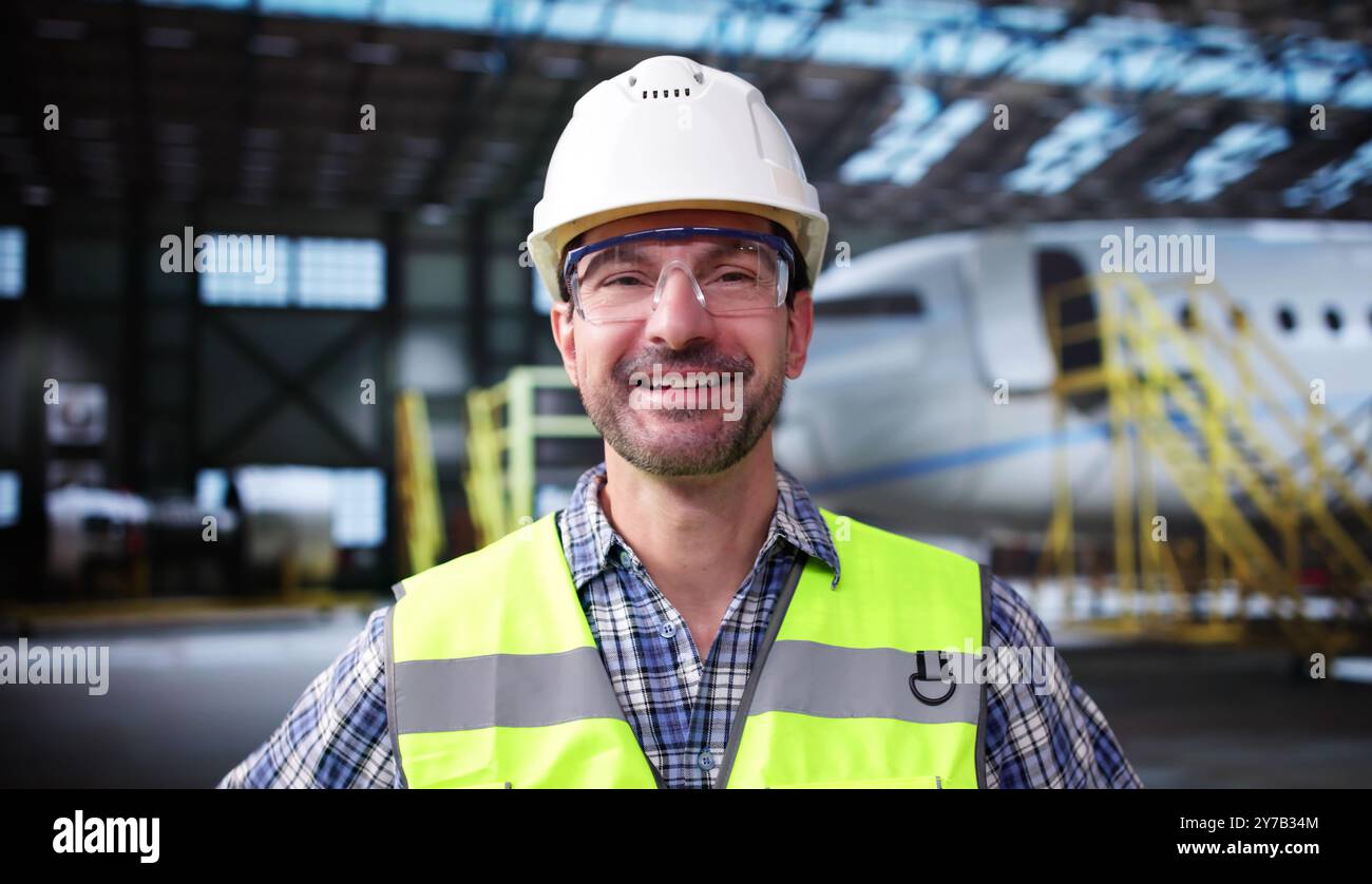 Aviation Aircraft Technician Portrait At Airport Hangar With Plane ...