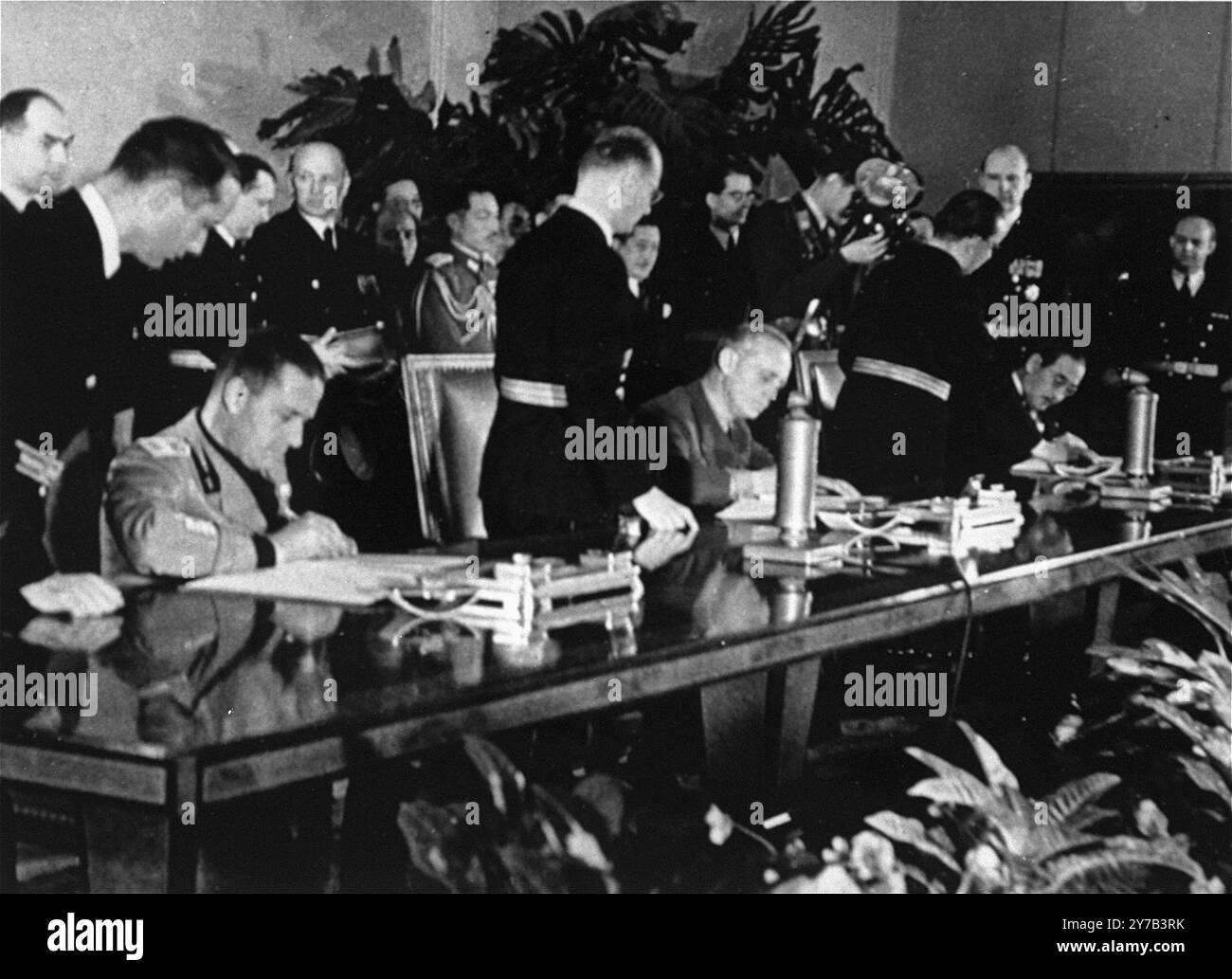 Representatives of the governments of Italy, Germany, and Japan sign ...