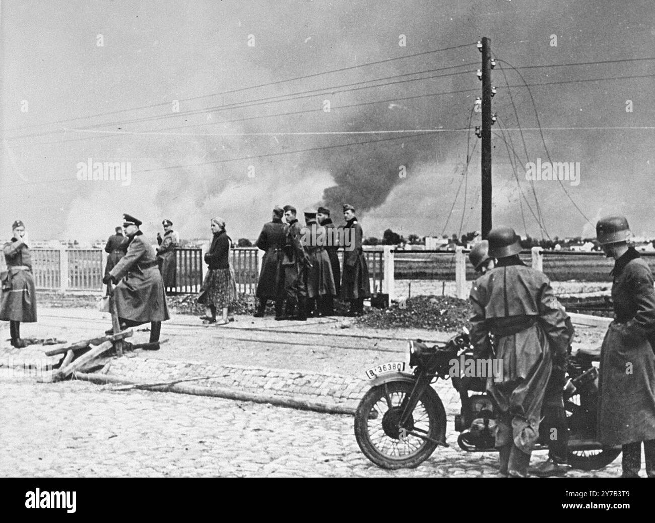 German troops and Polish civilians stop on a bridge on the outskirts of ...