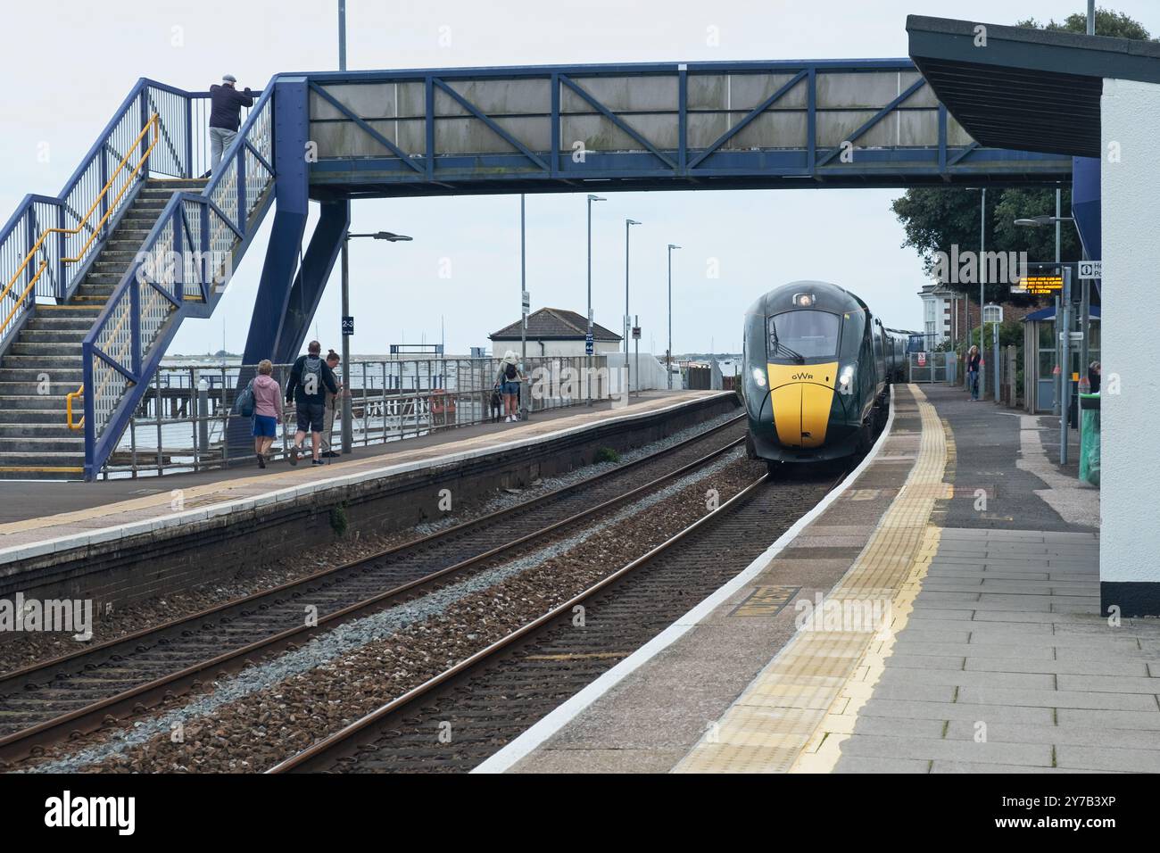 Devon, England – 24th September, 2024: Passengers stand back as an ...