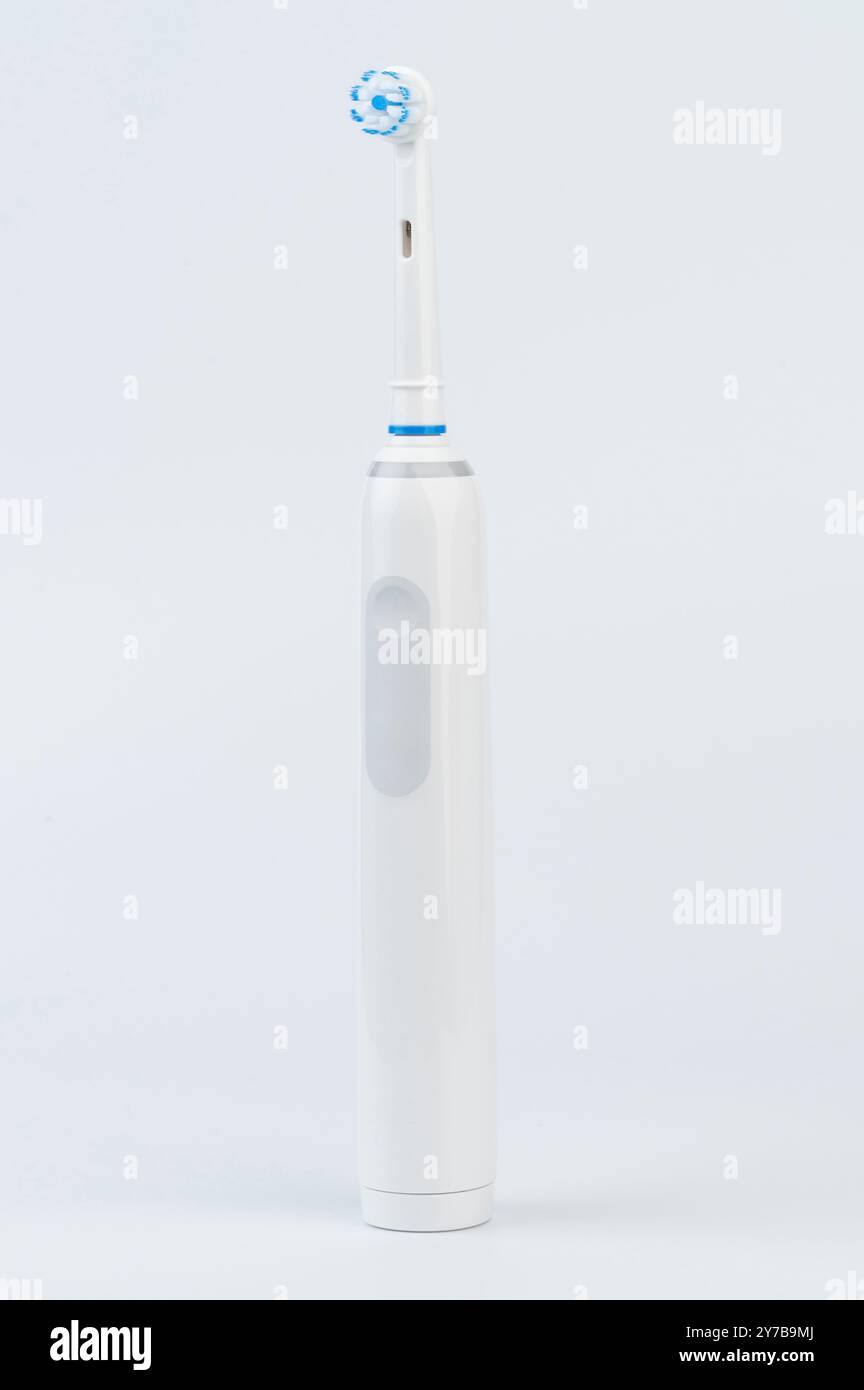 Modern white electric toothbrush isolated on studio background Stock ...