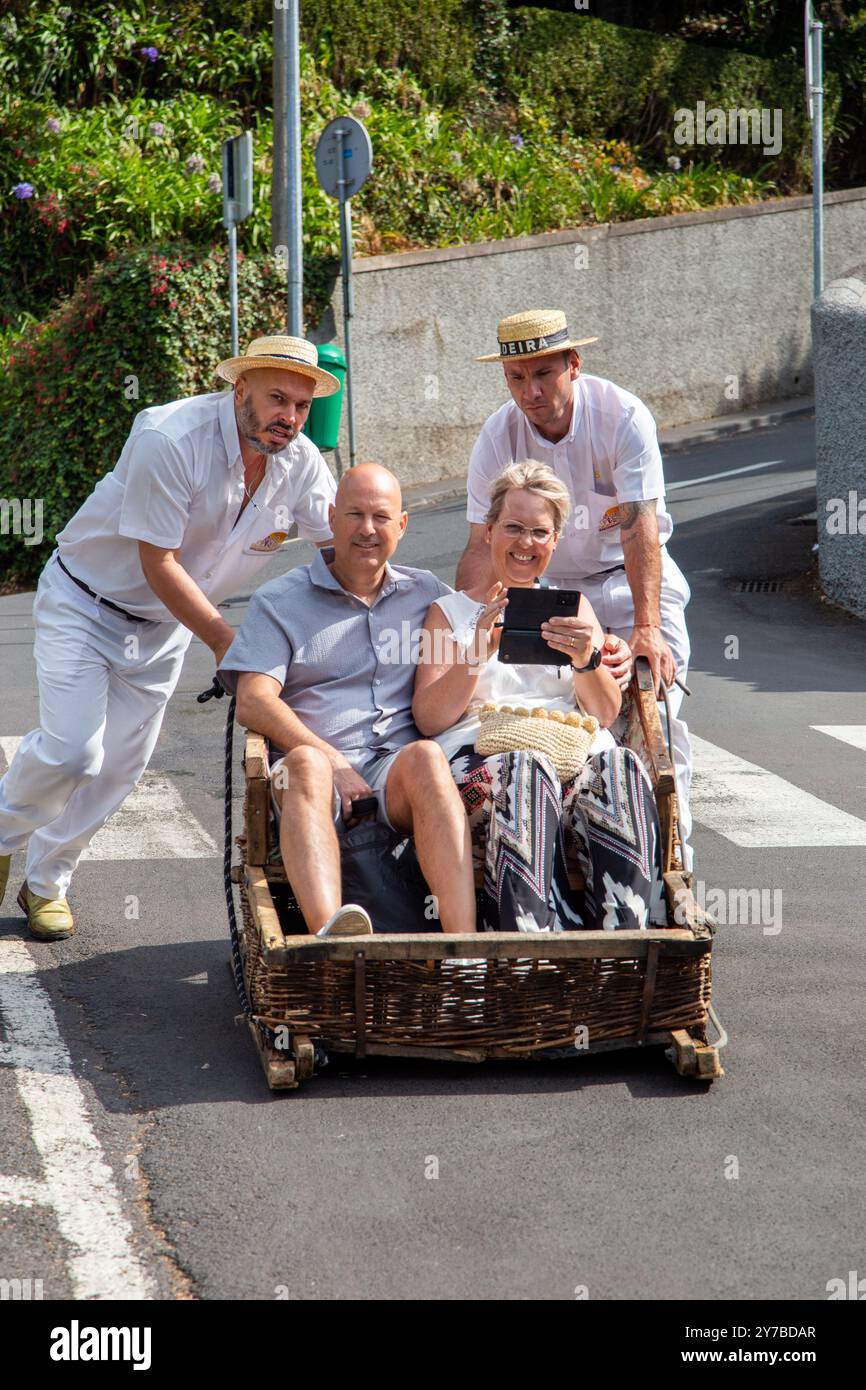 Holidaymakers and tourists having fun taking a ride in traditional ...