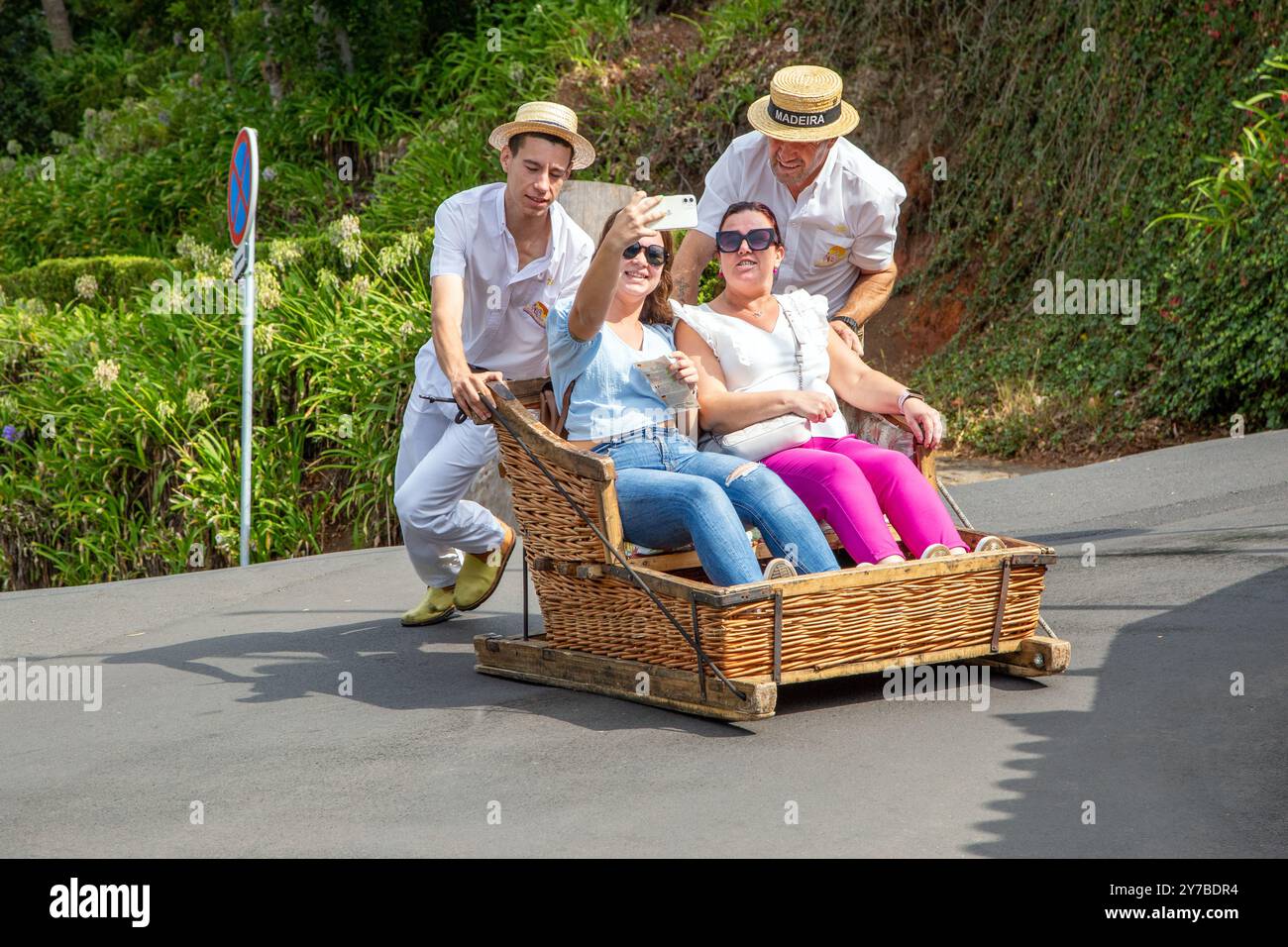 Holidaymakers and tourists having fun taking a ride in traditional ...