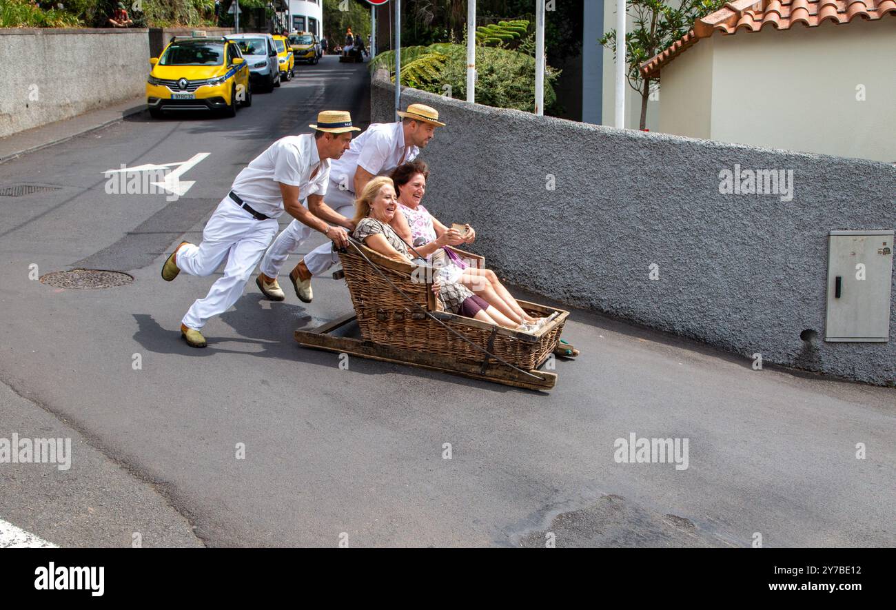 Holidaymakers and tourists having fun taking a ride in traditional ...