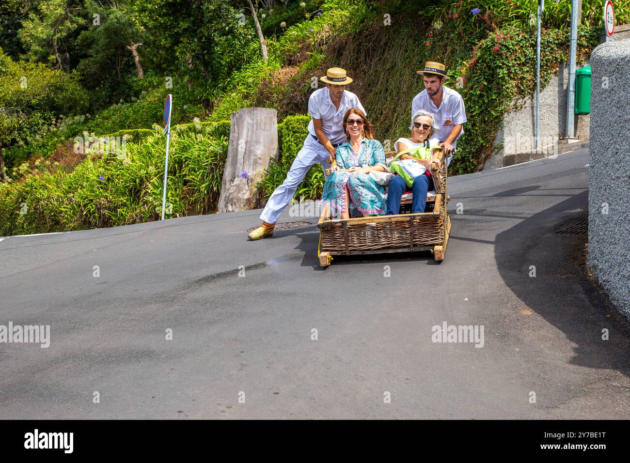 Holidaymakers and tourists having fun taking a ride in traditional ...