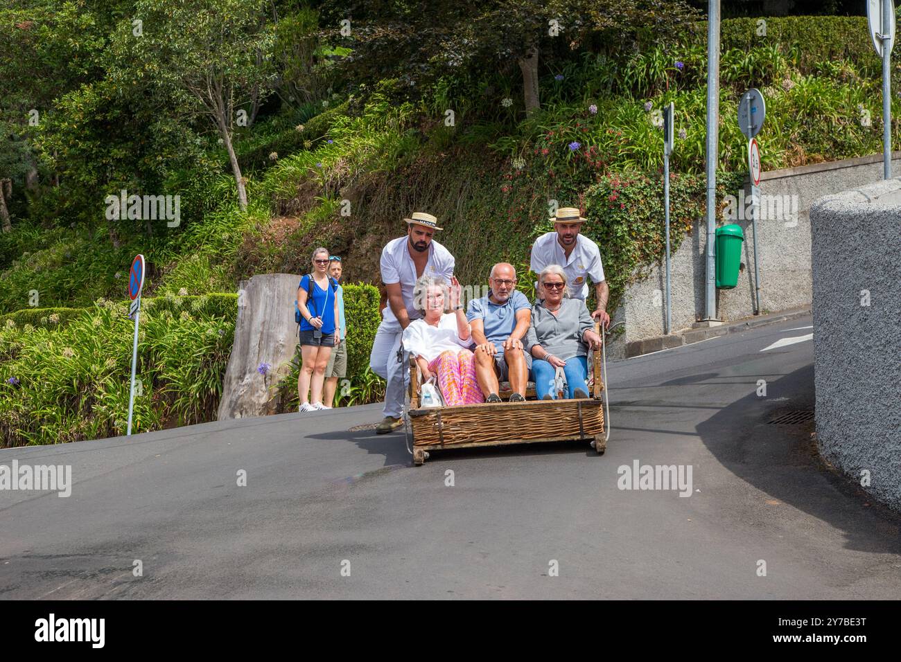 Holidaymakers and tourists having fun taking a ride in traditional ...