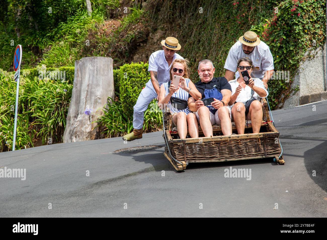 Holidaymakers and tourists having fun taking a ride in traditional ...