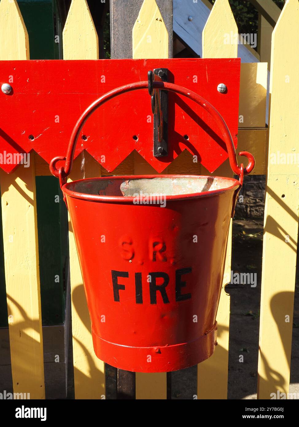 Red vintage fire bucket at Midsomer Norton Station, Somerset, operated ...