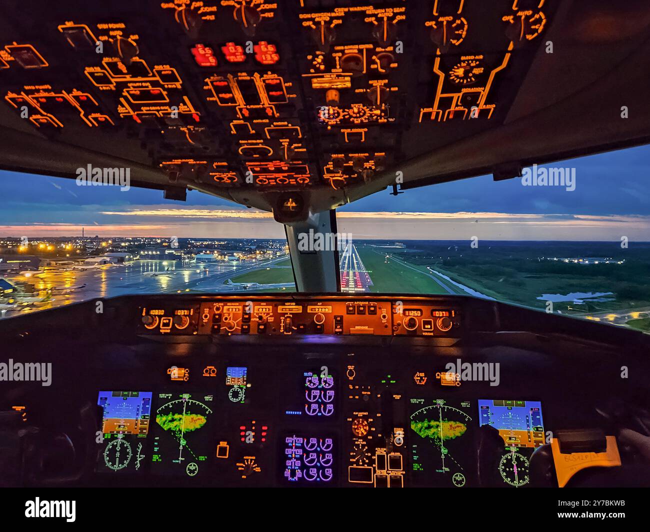 Airplane cockpit view during night landing approach with runway lights. High quality photo Stock ...