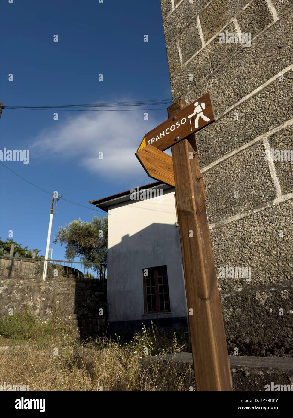 A hiking sign post in a trail in the village of Alvarenga, near Arouca ...