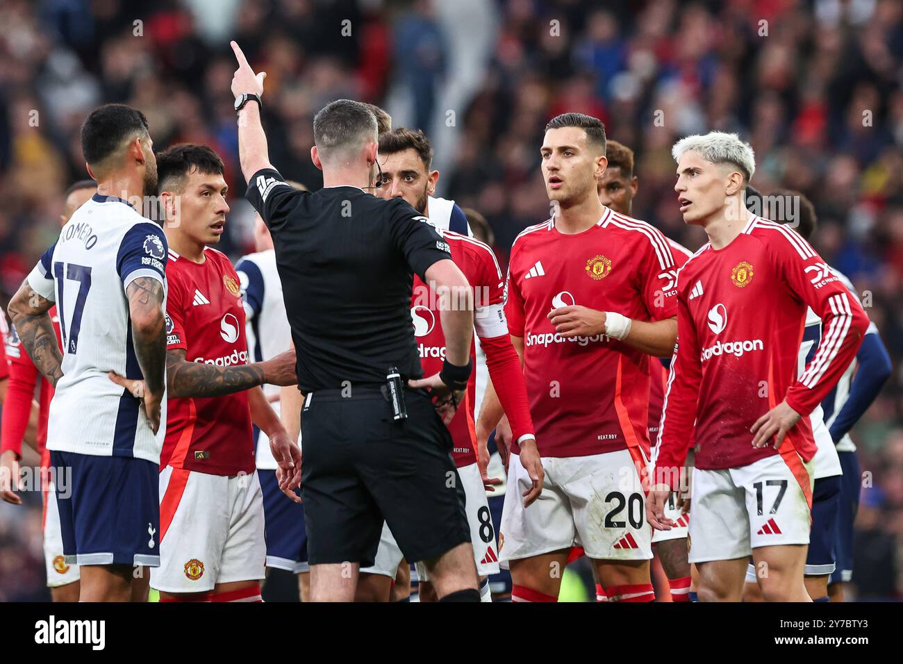Referee Chris Kavanagh gives a red card to Bruno Fernandes of ...