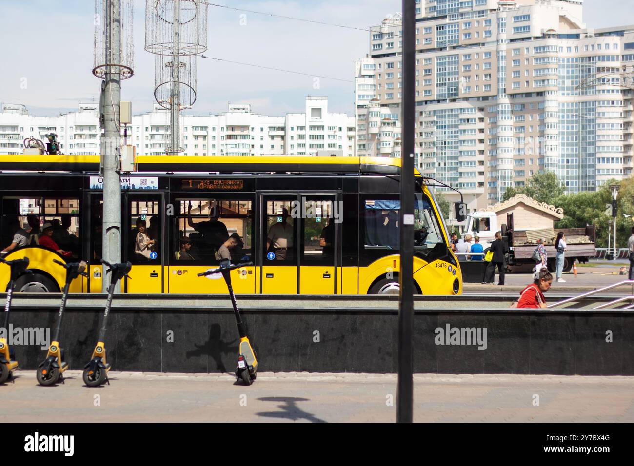 Belarus, Minsk - 24 june, 2024: A bright yellow bus displaying the number 24 prominently on the ...