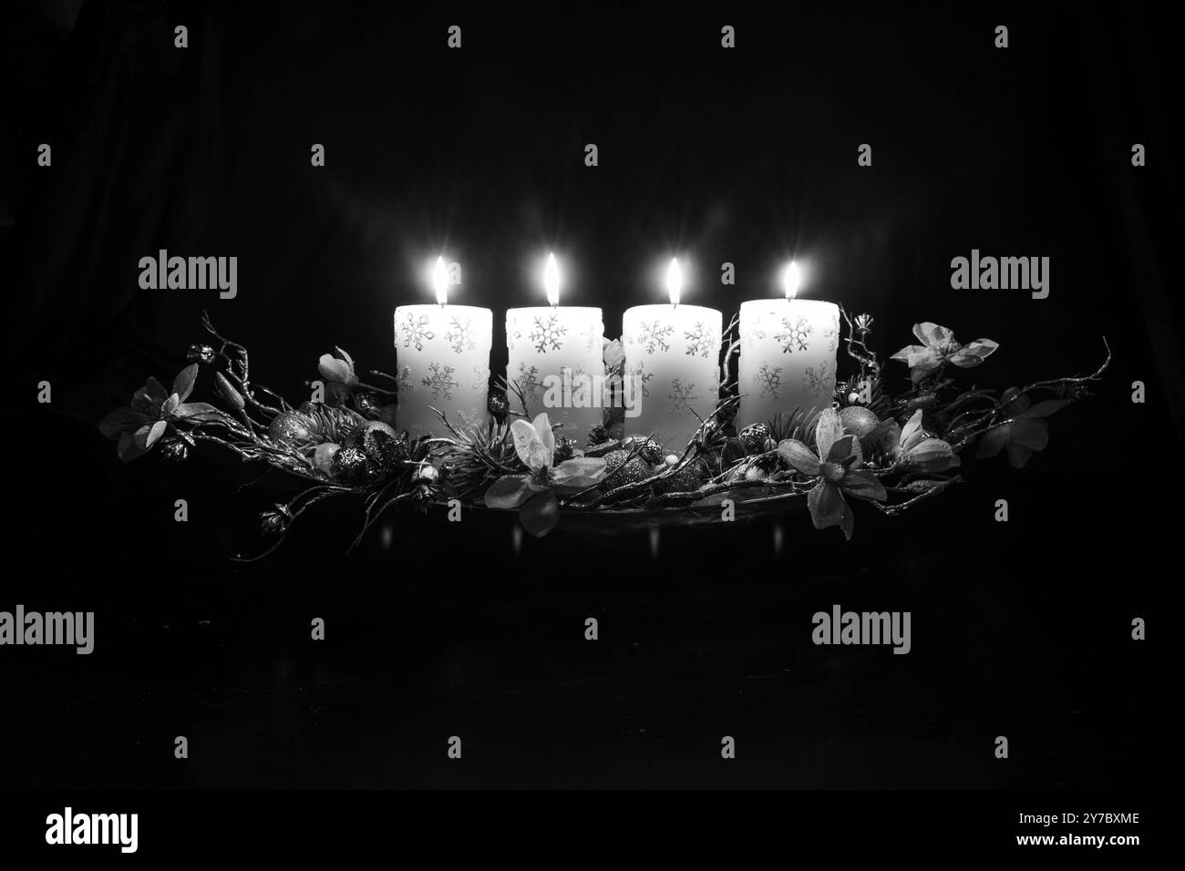 four white advent candles, four advent candles with light, dark black ...