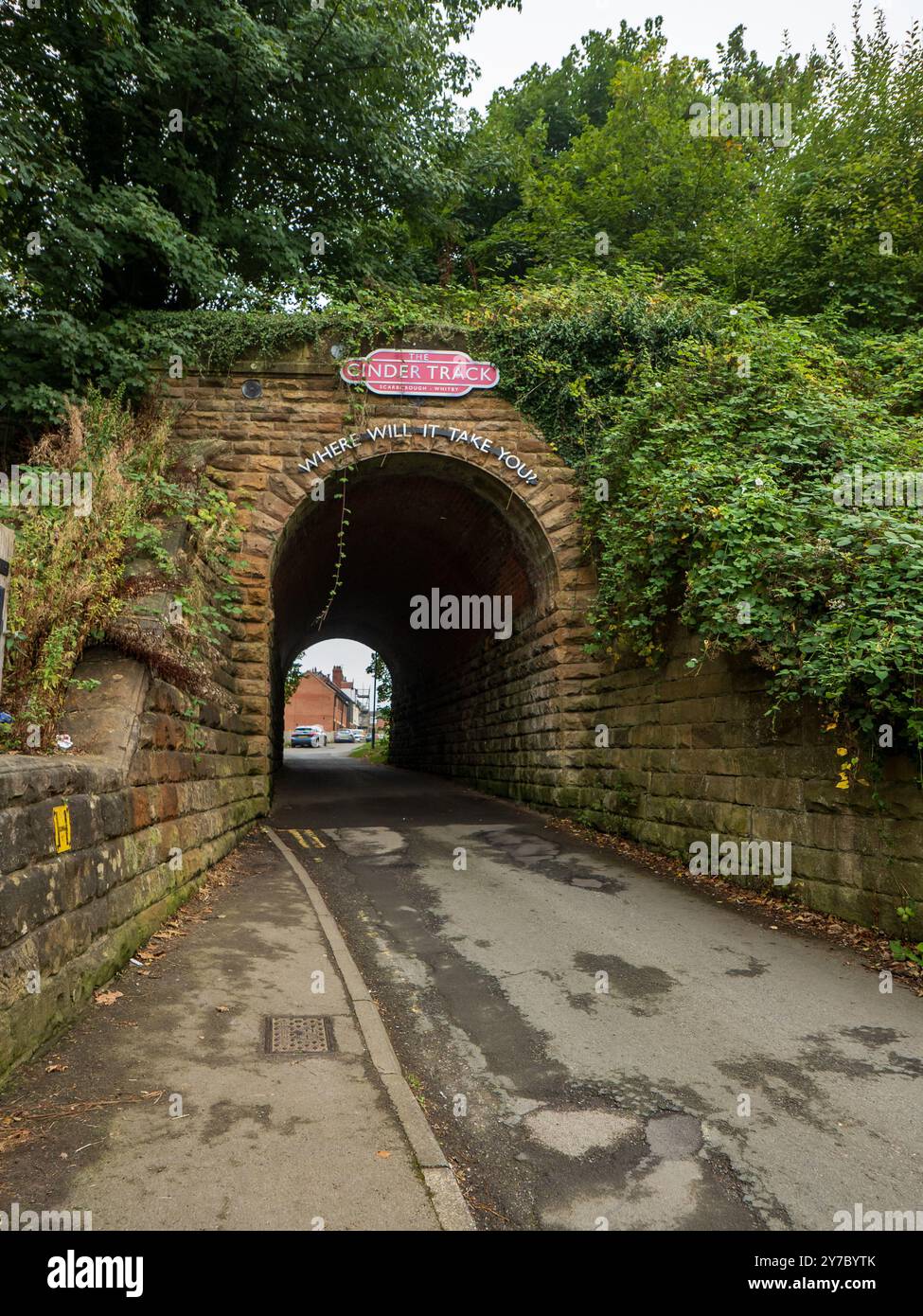 The arch entrance to the Cinder Track Stock Photo - Alamy