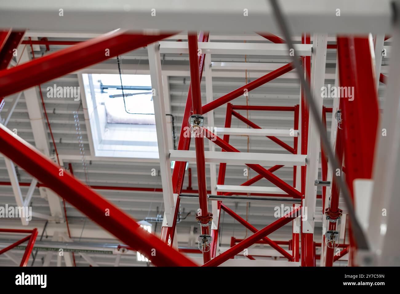 Close up photograph of sprinkler system head inside warehouse racking ...