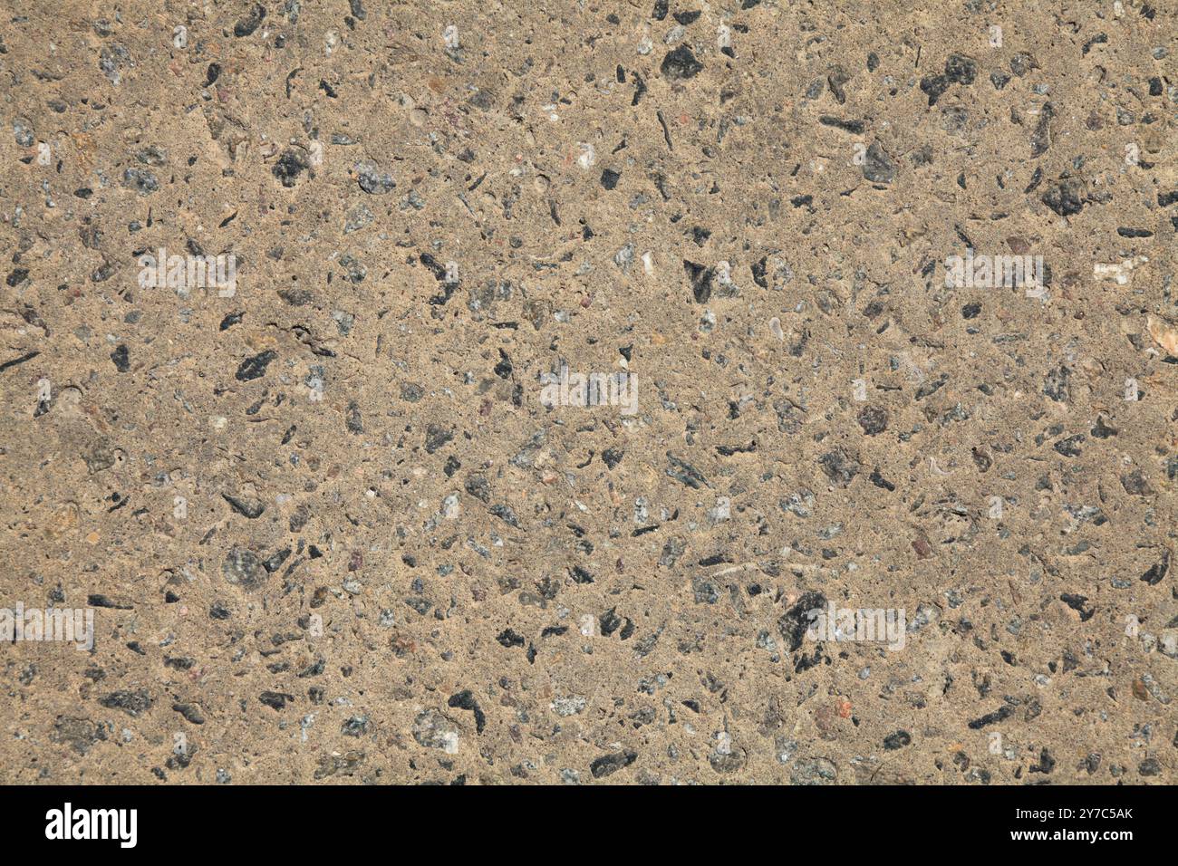 Light-gray concrete surface, background. Texture of concrete slab or supporting wall with gravel ...