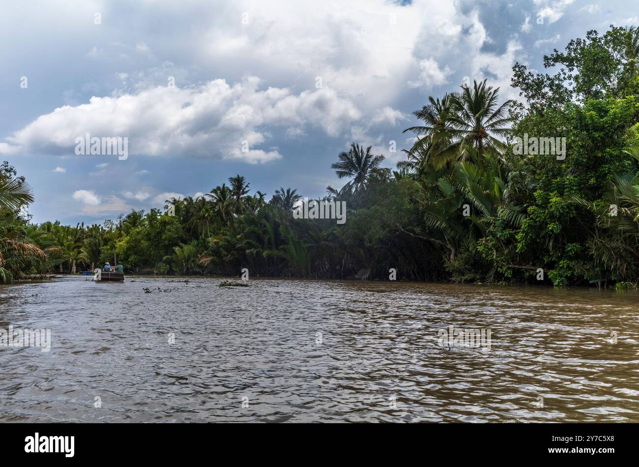 Small paddle boats and sampans in the narrow water canals in Ben Tre in ...
