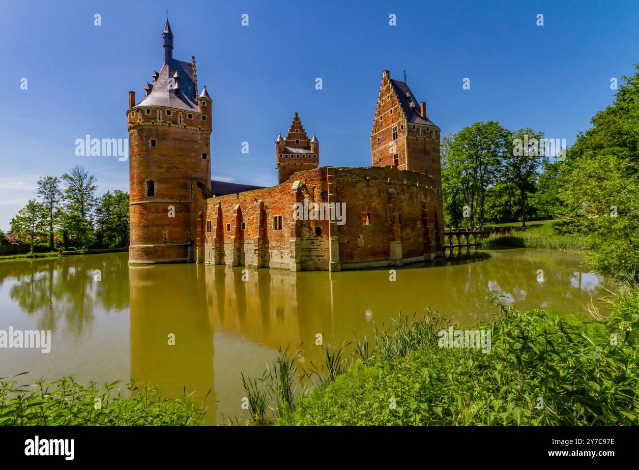 Beersel Castle. The walls and towers of the medieval castle reflected ...
