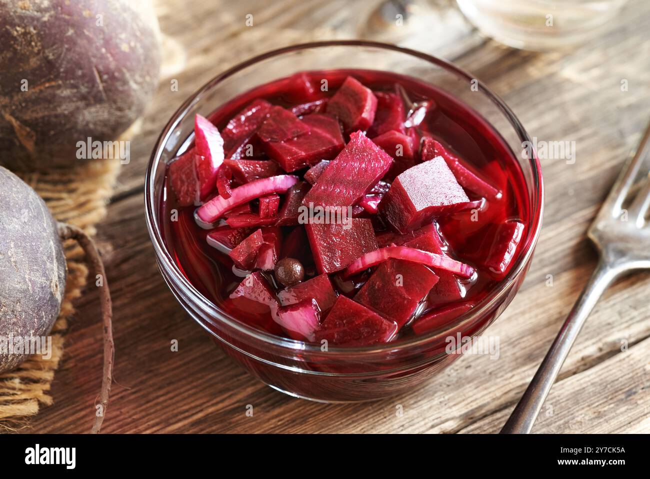 Fermented red beet kvass in a glass bowl with a fork. Probiotic food Stock Photo - Alamy