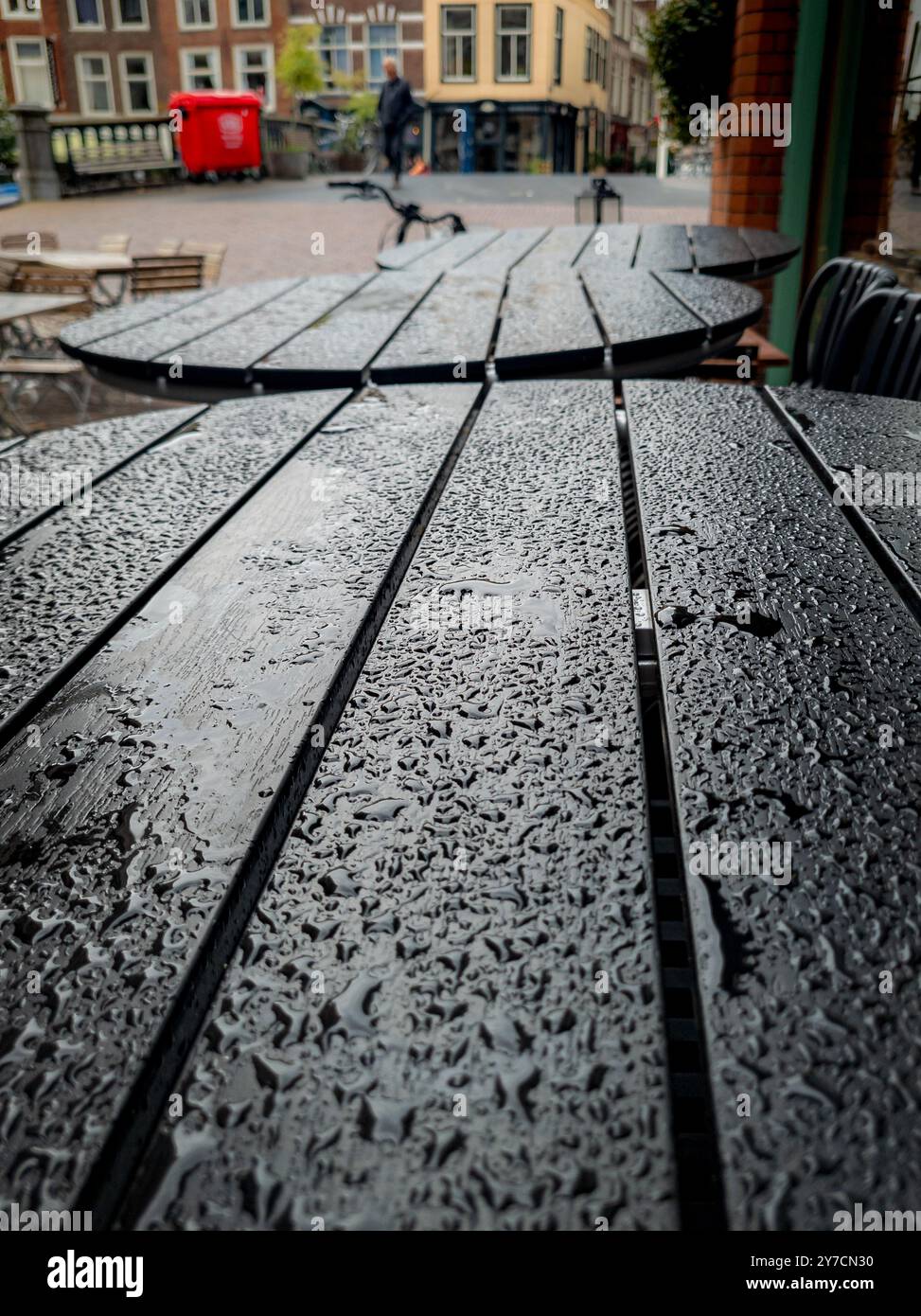 Black coffee shop table surface, covered with raindrops, Leiden ...