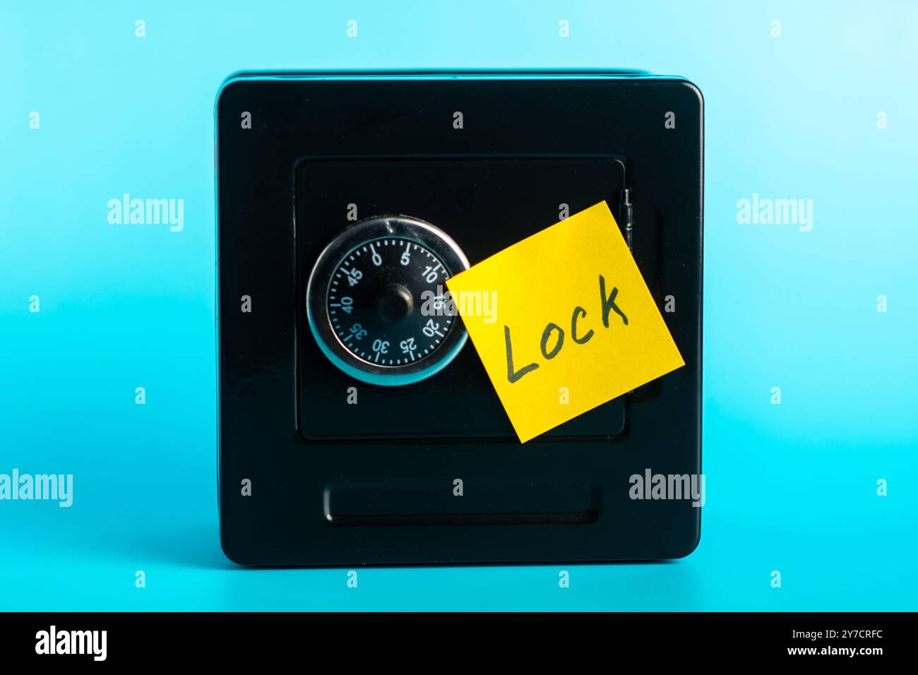 Secure box with combination lock and sticky note reminder Stock Photo ...
