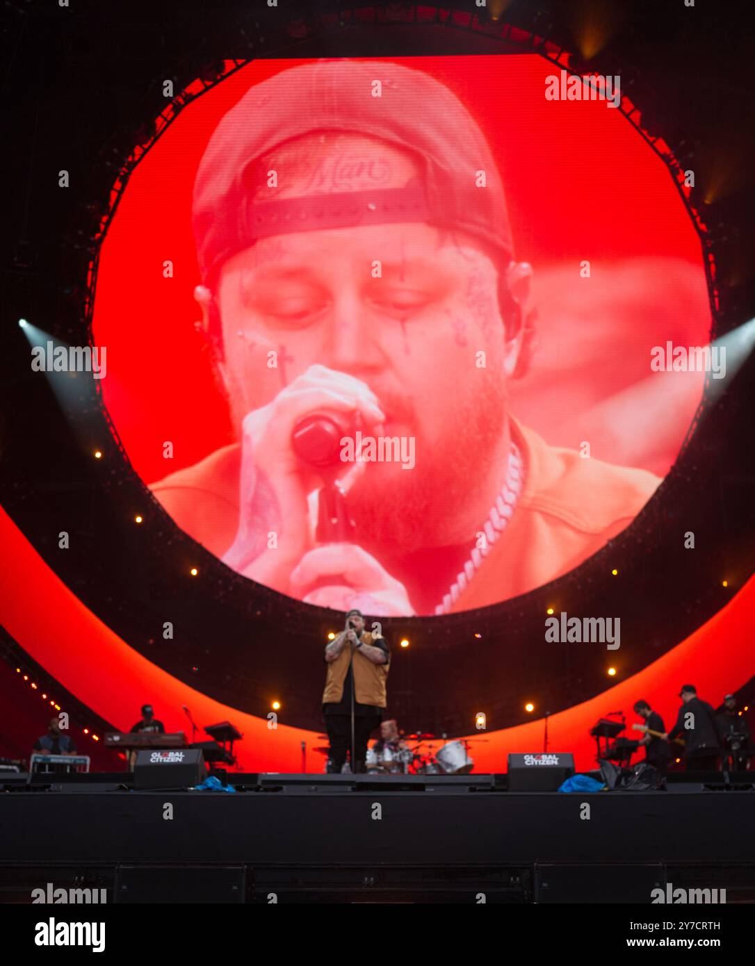 Jelly Roll performing energetically onstage at the Global Citizen ...