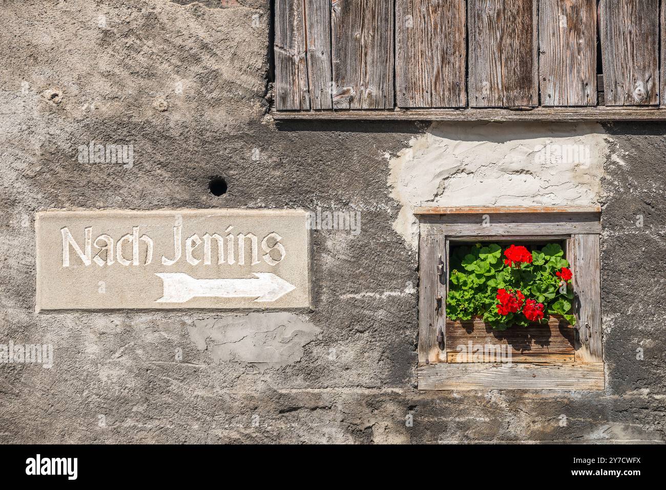 Direction Jenins, Signpost and Village House with Geraniums in Old Town ...