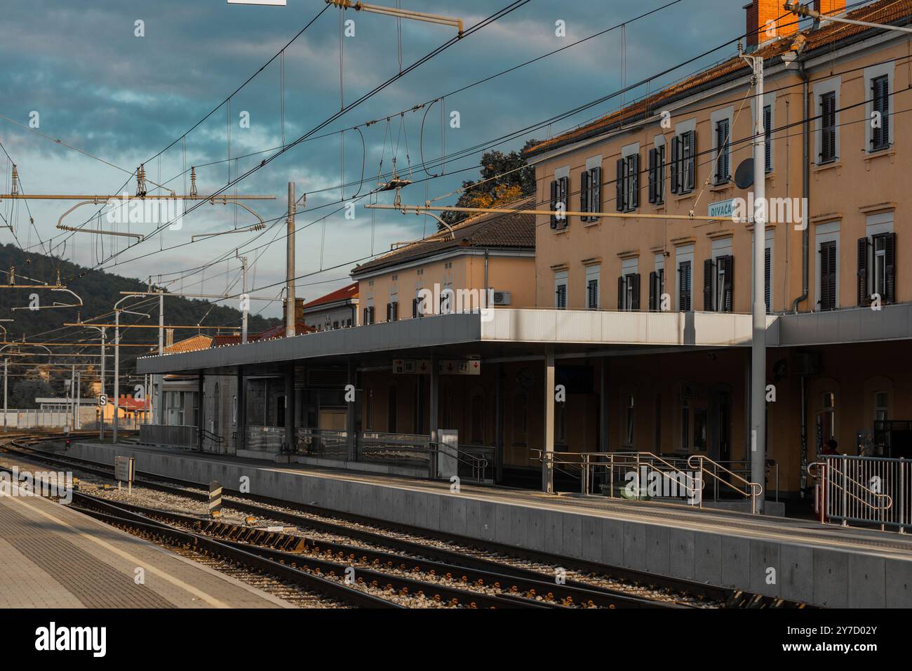 Train station of Divaca viewed from a train standing on a platform. Old ...
