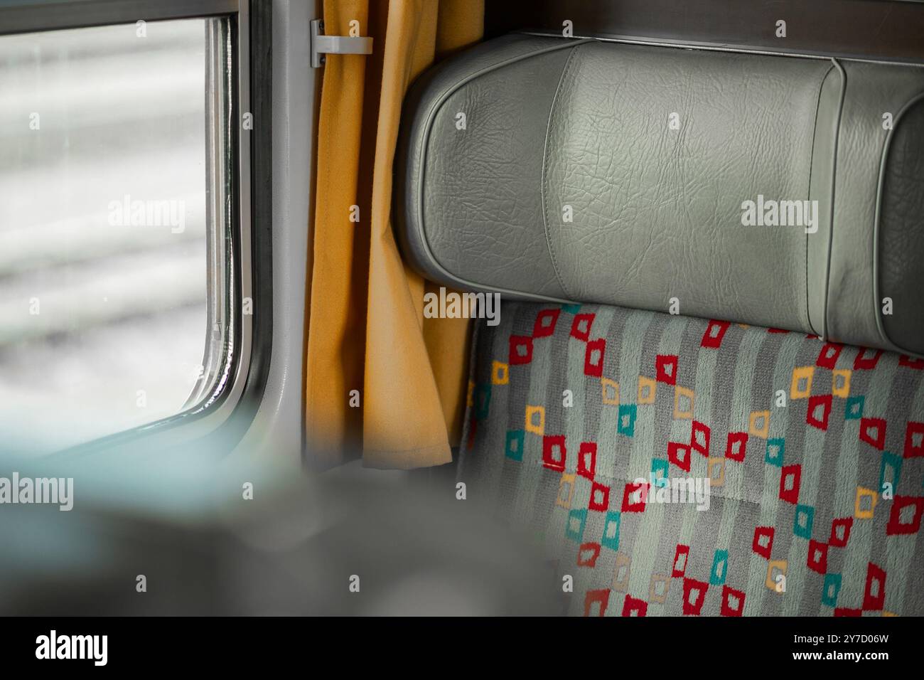 Interior of an old style train, vintage looking seat covers and leather ...
