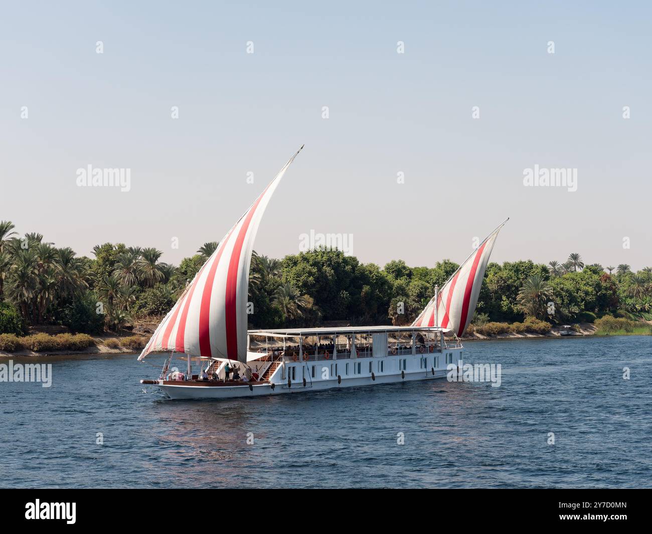 Traditional Egyptian felucca cruise sailing down the great Nile River ...