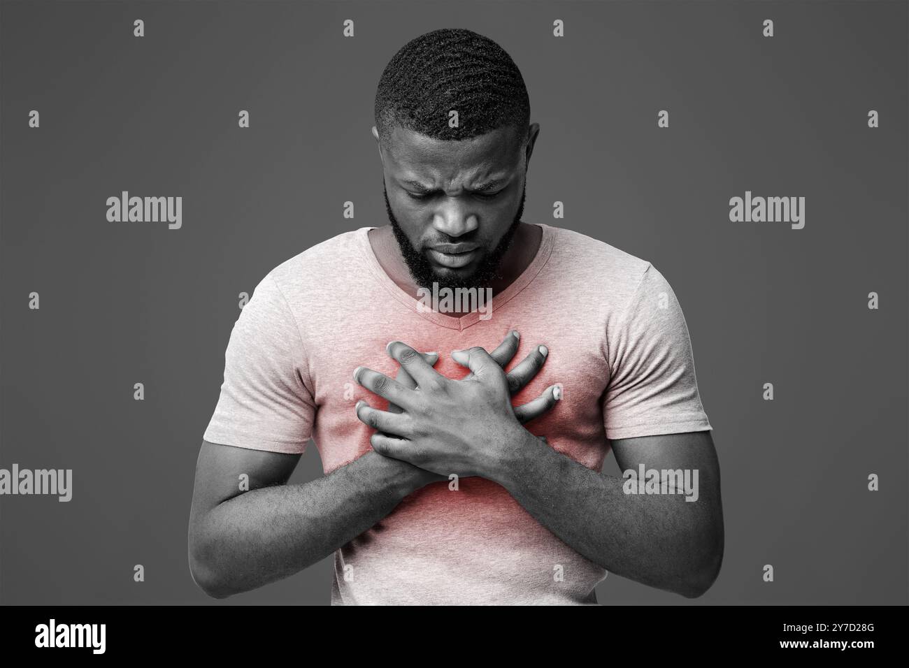 Sad young man suffering from acute pain in chest Stock Photo - Alamy