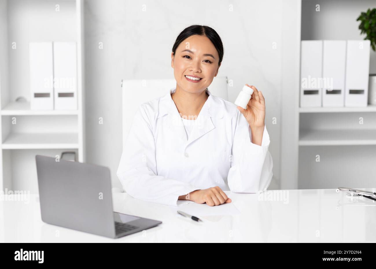 Healthcare professional demonstrating medication in a clinic setting ...