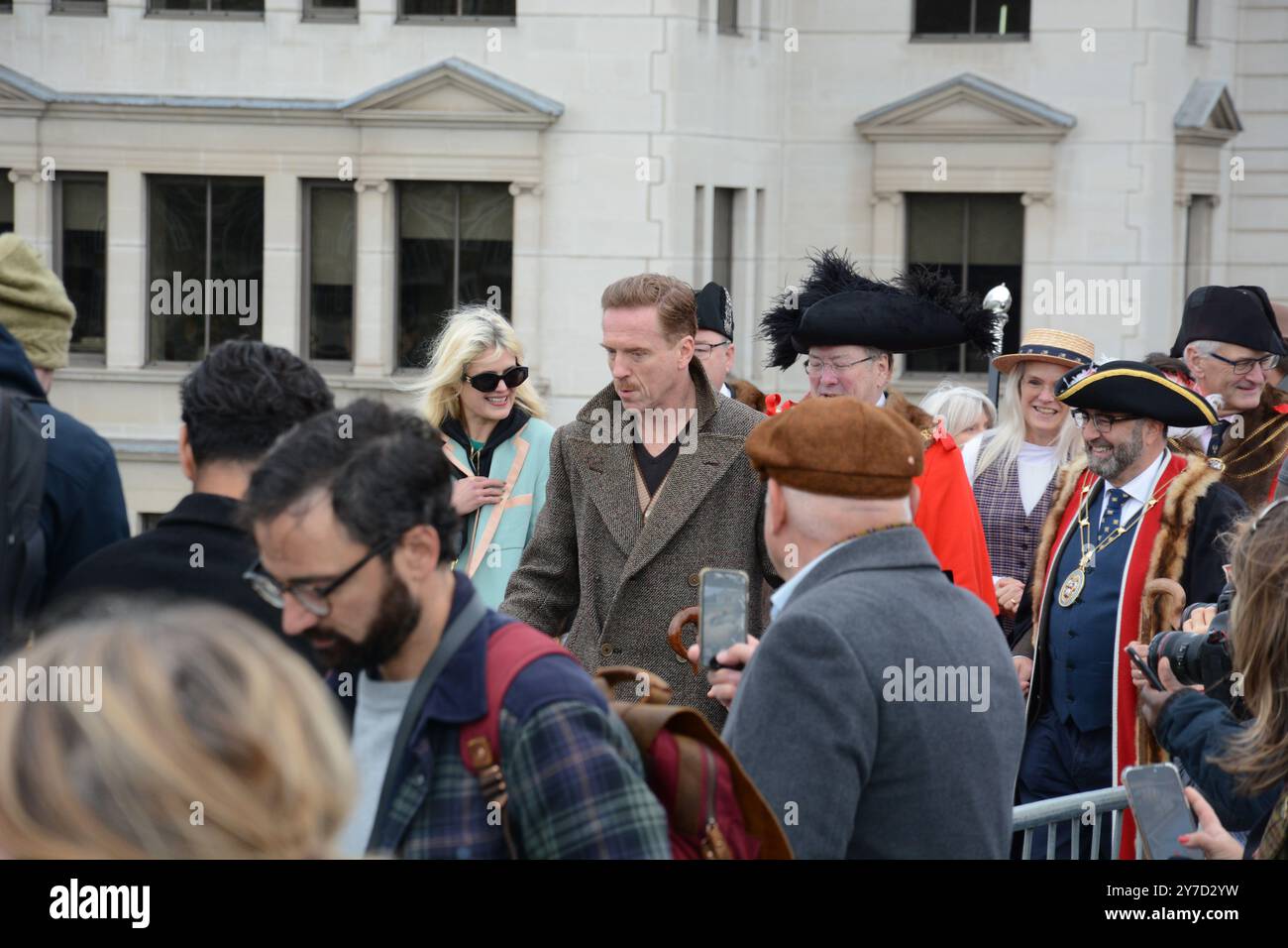 Damian Lewis shepherds sheep across Southwark Bridge in London as a ...