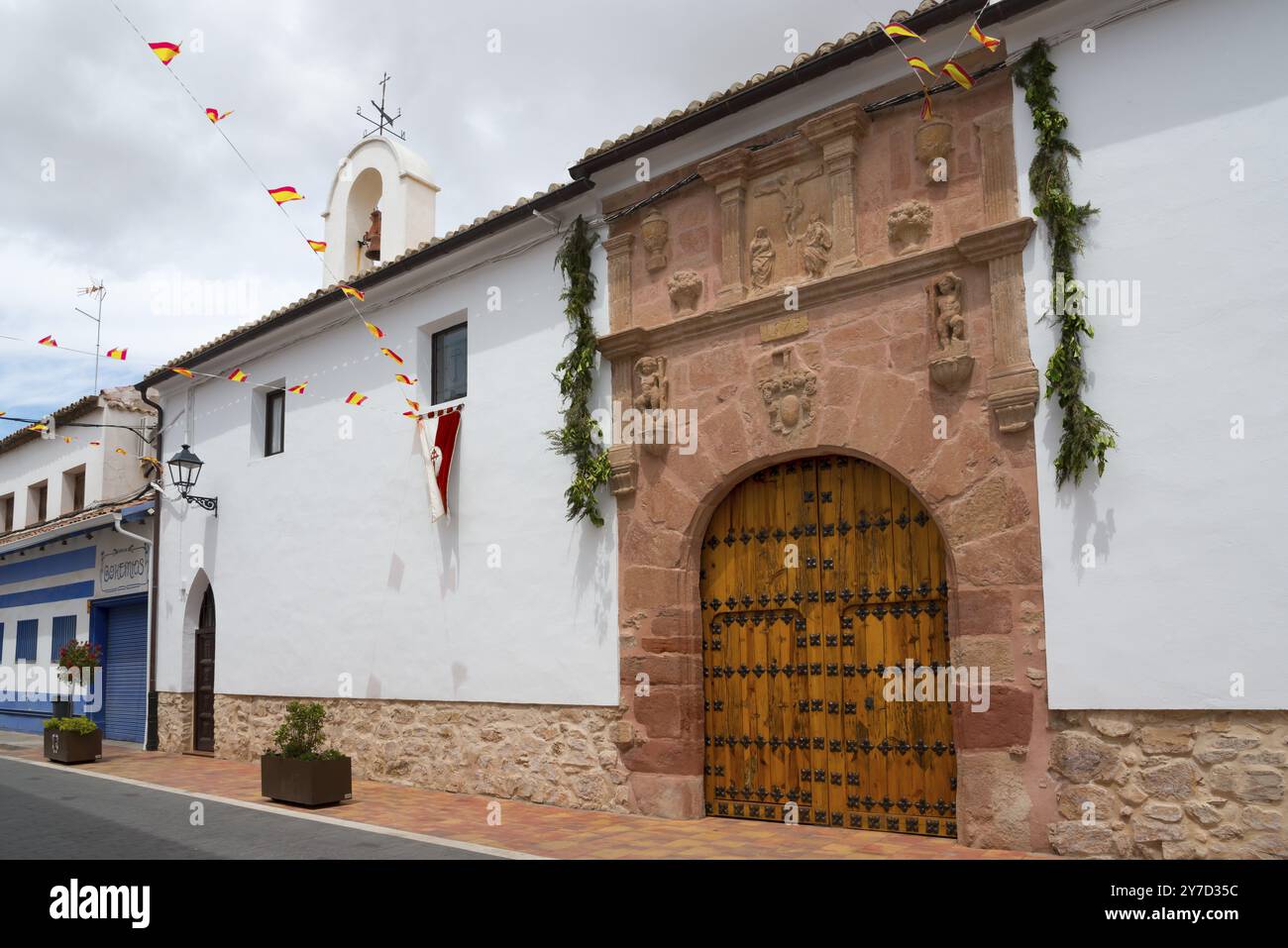 A magnificent entrance gate of a stone building decorated with Spanish ...