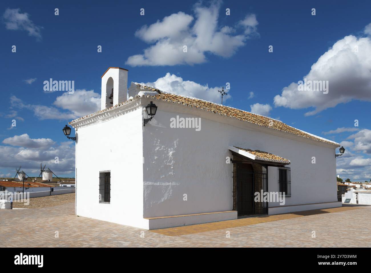White chapel under a blue sky with clouds, rural architecture and a ...