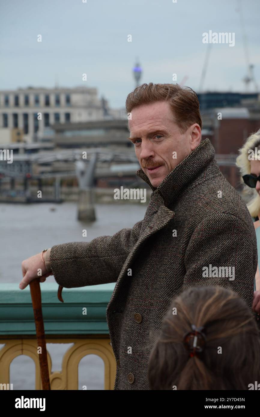 Damian Lewis shepherds sheep across Southwark Bridge in London as a ...
