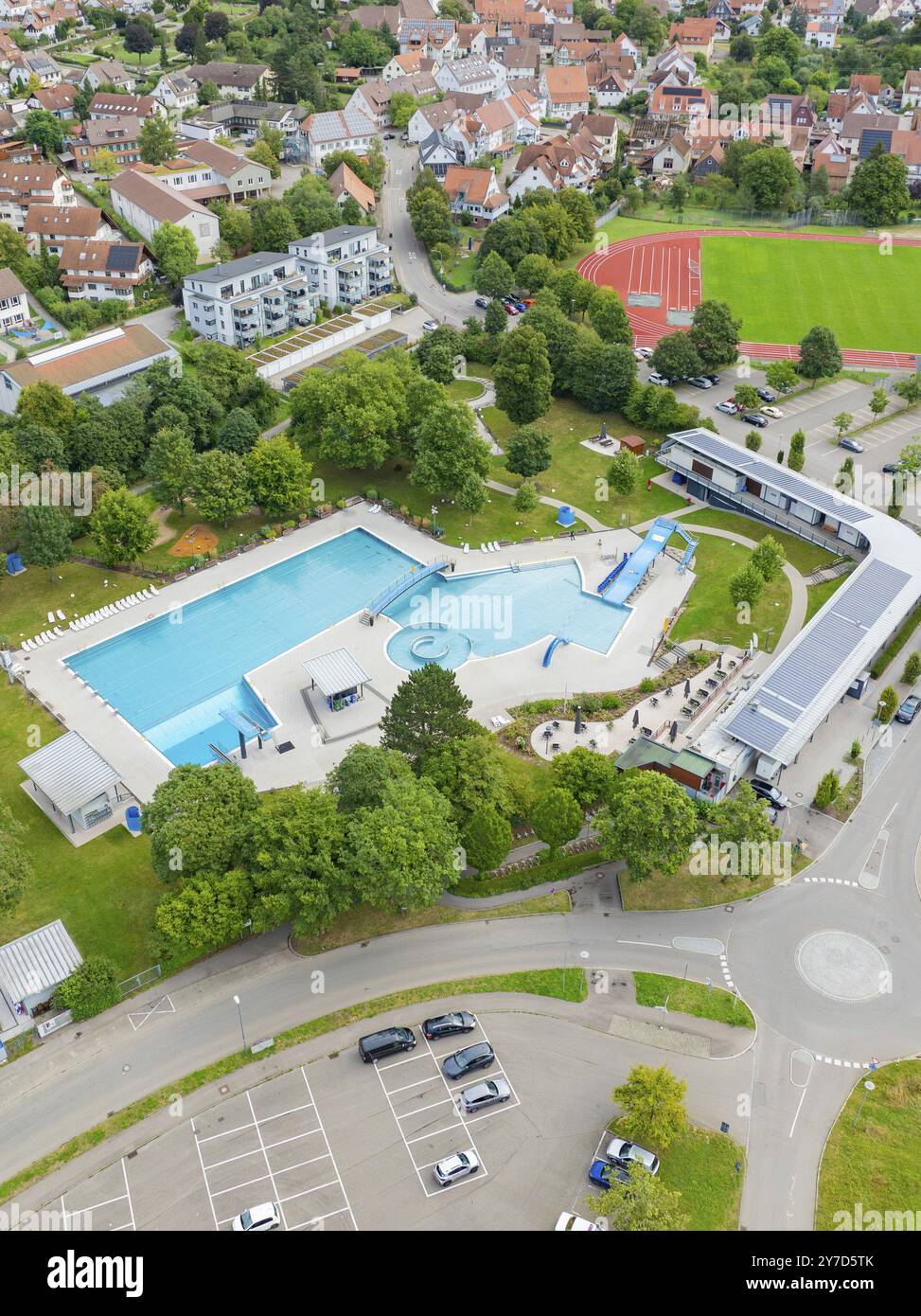 Aerial view of an outdoor pool with swimming pool and surrounding ...
