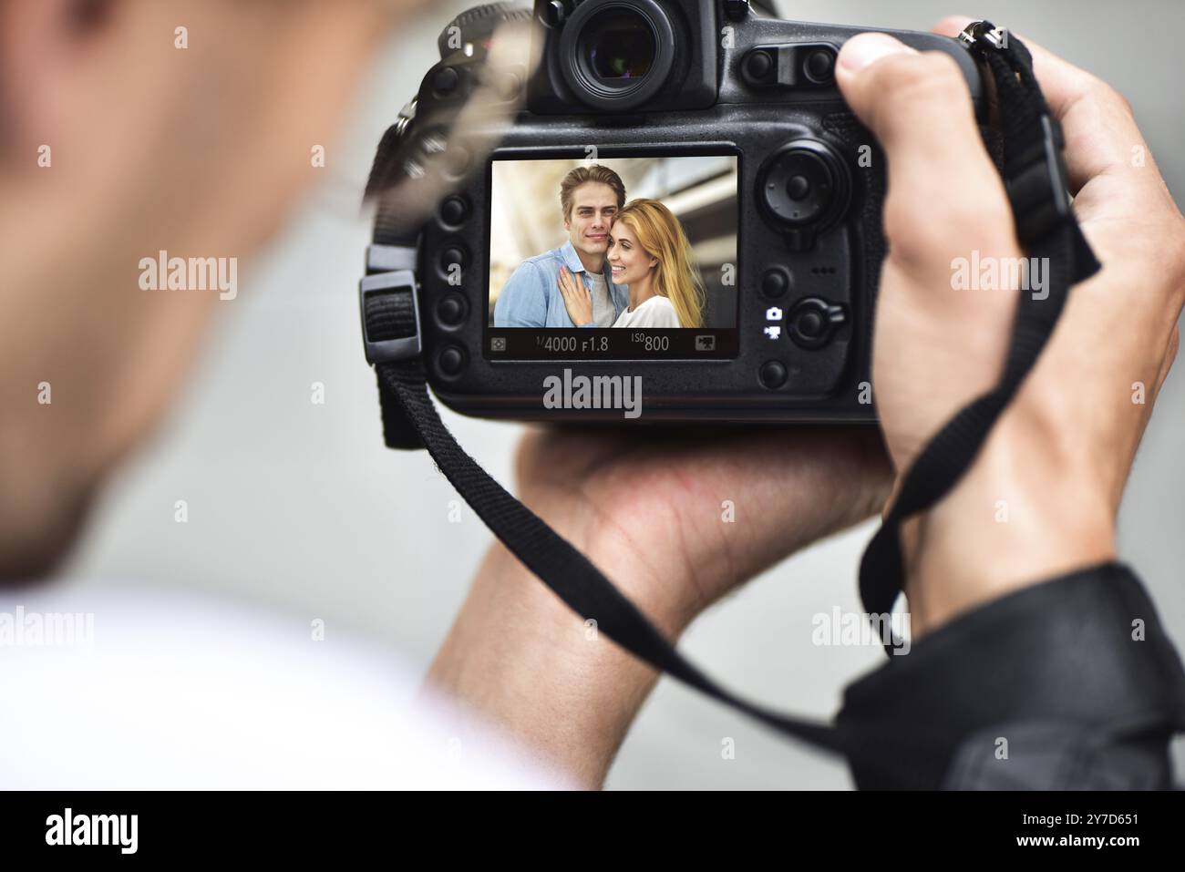 Digital single-lens reflex camera in hands. Photographer shooting hands ...