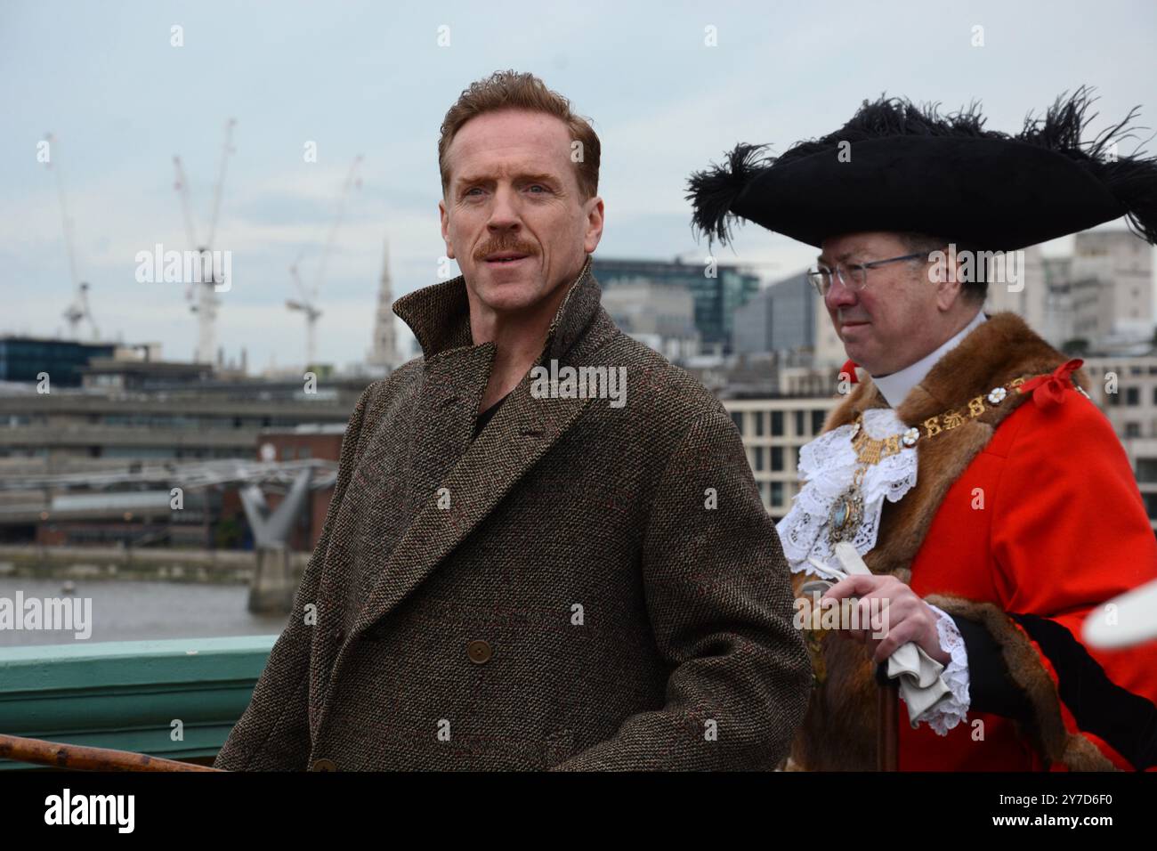 Damian Lewis shepherds sheep across Southwark Bridge in London as a ...