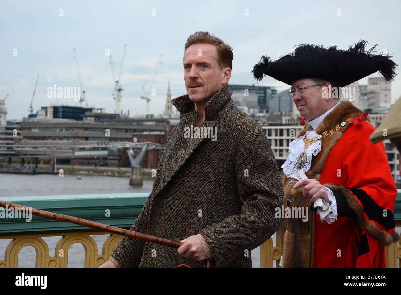 Damian Lewis shepherds sheep across Southwark Bridge in London as a ...