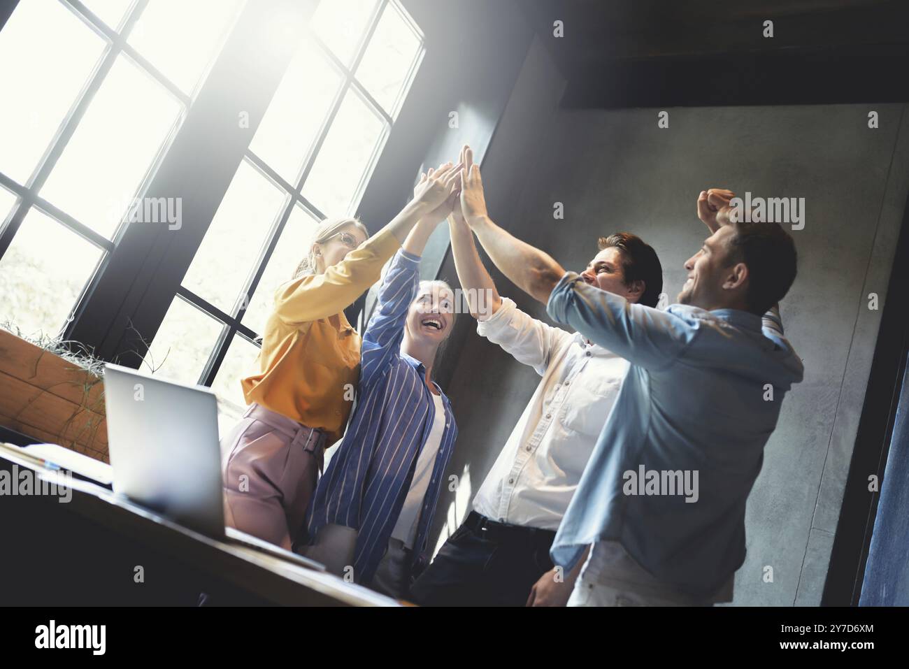 Close up top view of young business people putting their hands together. Stack of hands. Unity ...