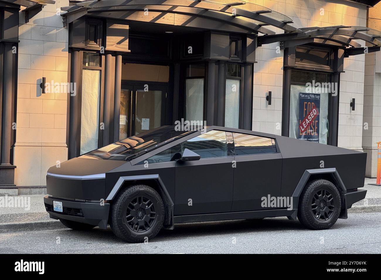 Tesla Cybertruck, Modern matte black car on the street in front of a ...