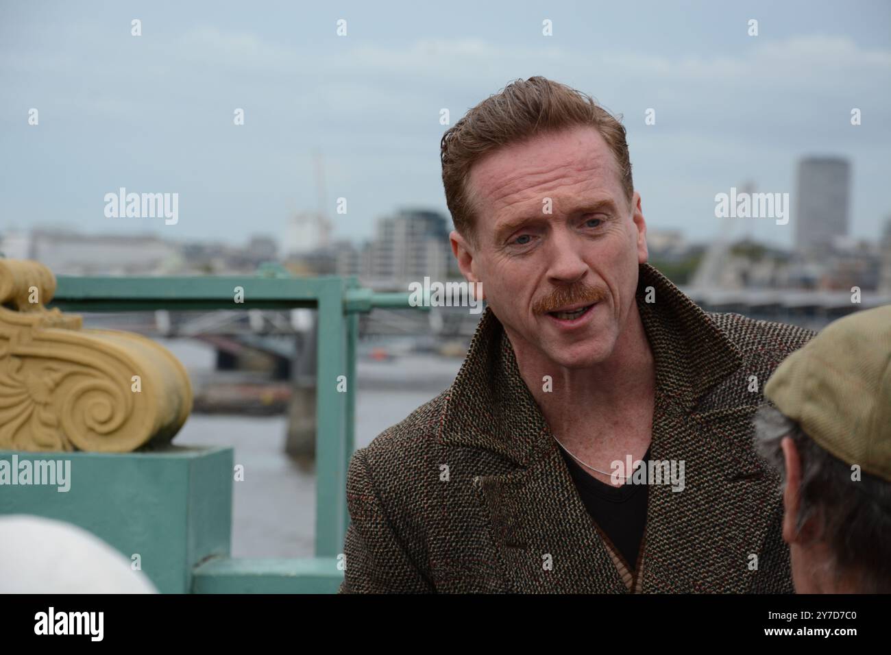 Damian Lewis shepherds sheep across Southwark Bridge in London as a ...