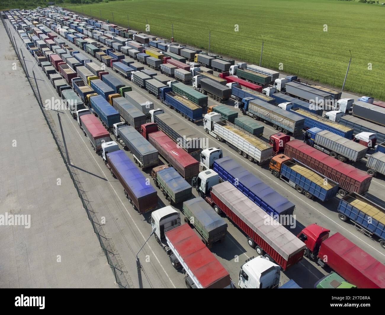 Long queue of trucks in the port at the terminal. Top view of the ...