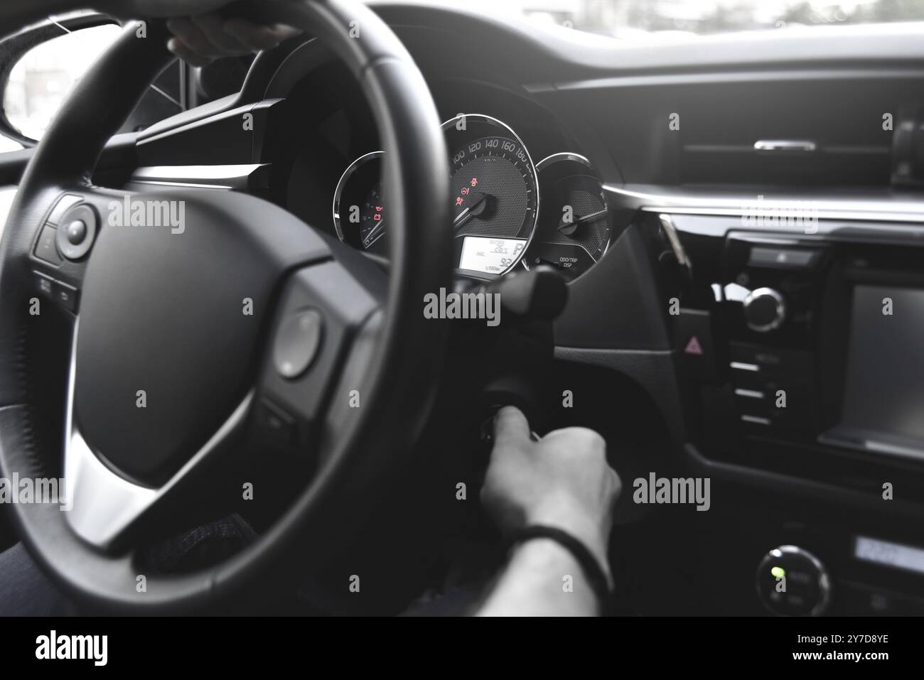 Male arms holding leathern rudder of car Stock Photo - Alamy